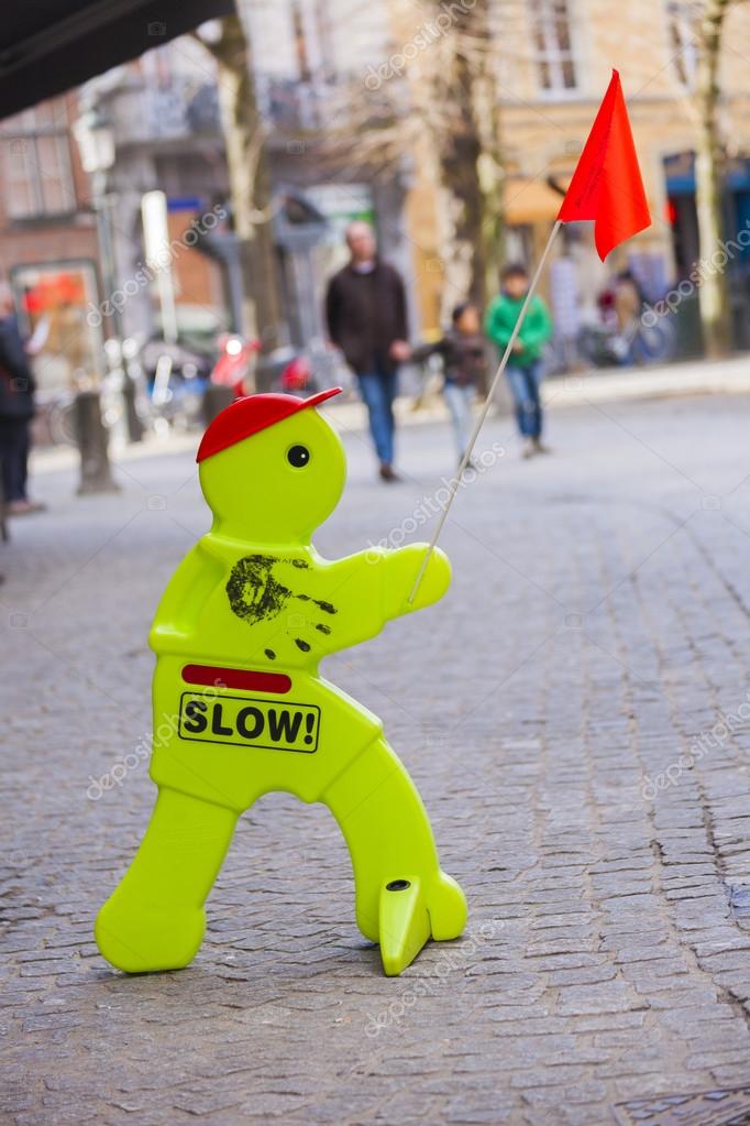 Plastic man slow road sign holding red flag Stock Photo by ©jenbray ...