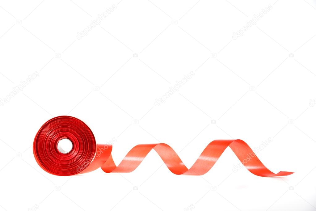 Red Ribbon from a roll on white background isolated — Stock Photo ...