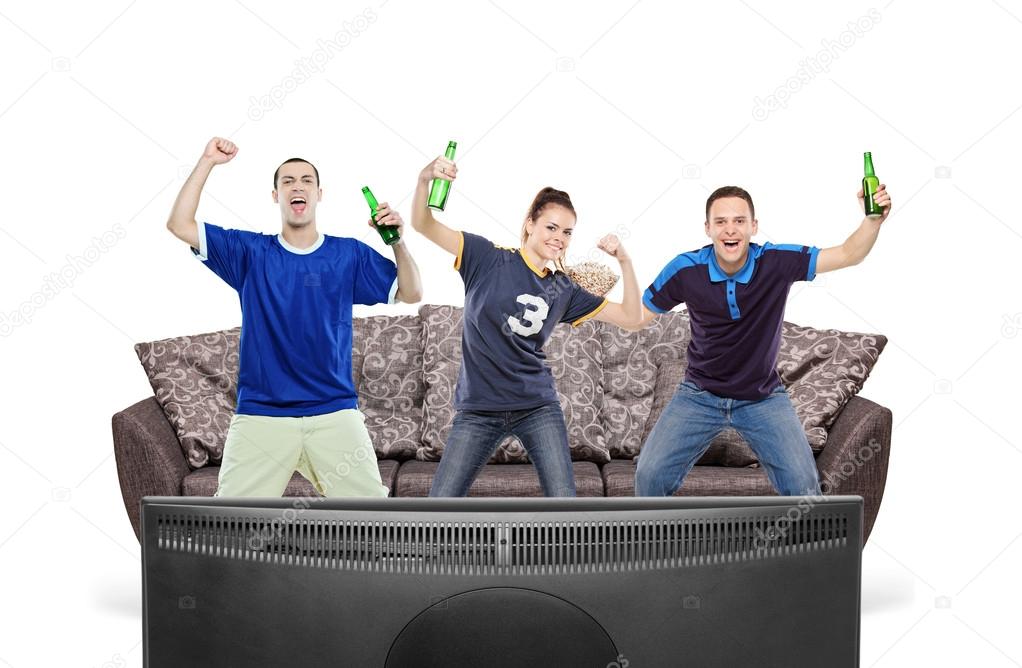 Three sport fans watching TV Stock Photo by ©ljsphotography 45854285