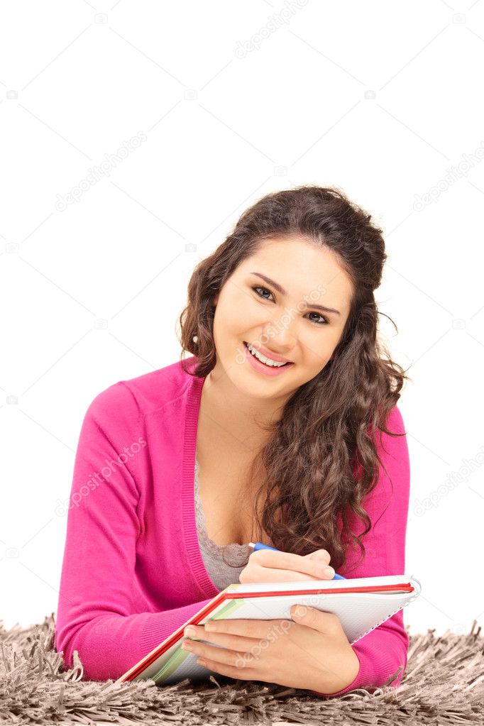 Smiling female writing on notebook — Stock Photo © ljsphotography #45855007