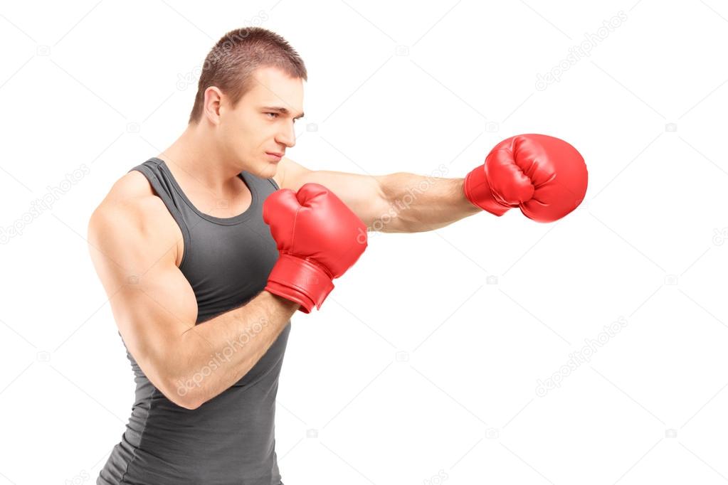 Male boxer punching with gloves — Stock Photo © ljsphotography #45869203