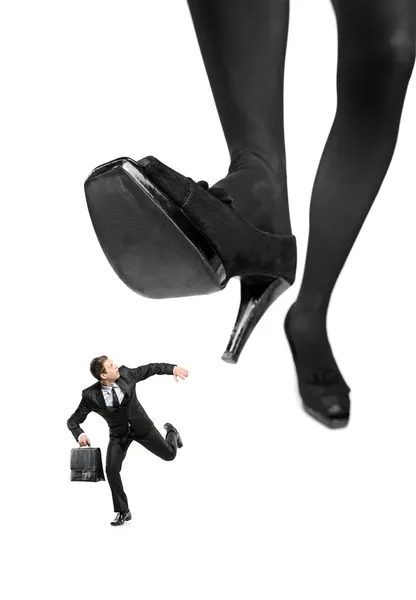 Woman Stepping On Tiny Man