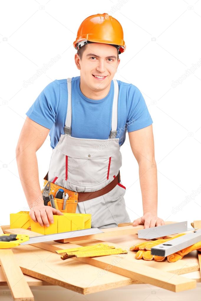 Manual worker standing next to table — Stock Photo © ljsphotography ...