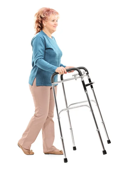Mature woman walking with walker — Stock Photo © ljsphotography #45881443