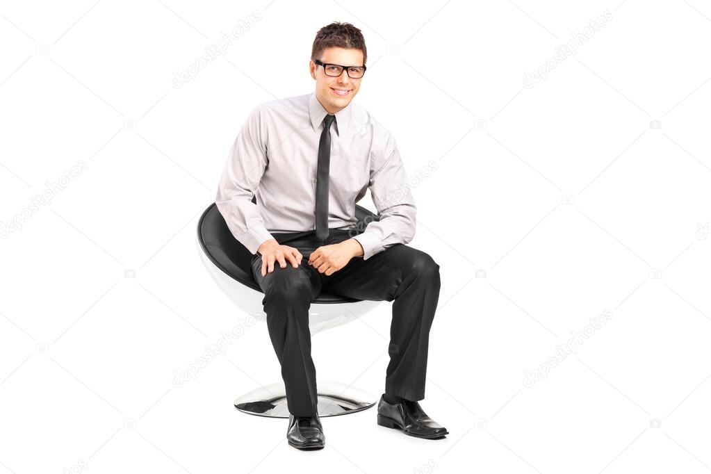 Handsome male sitting on chair Stock Photo by ©ljsphotography 45880879