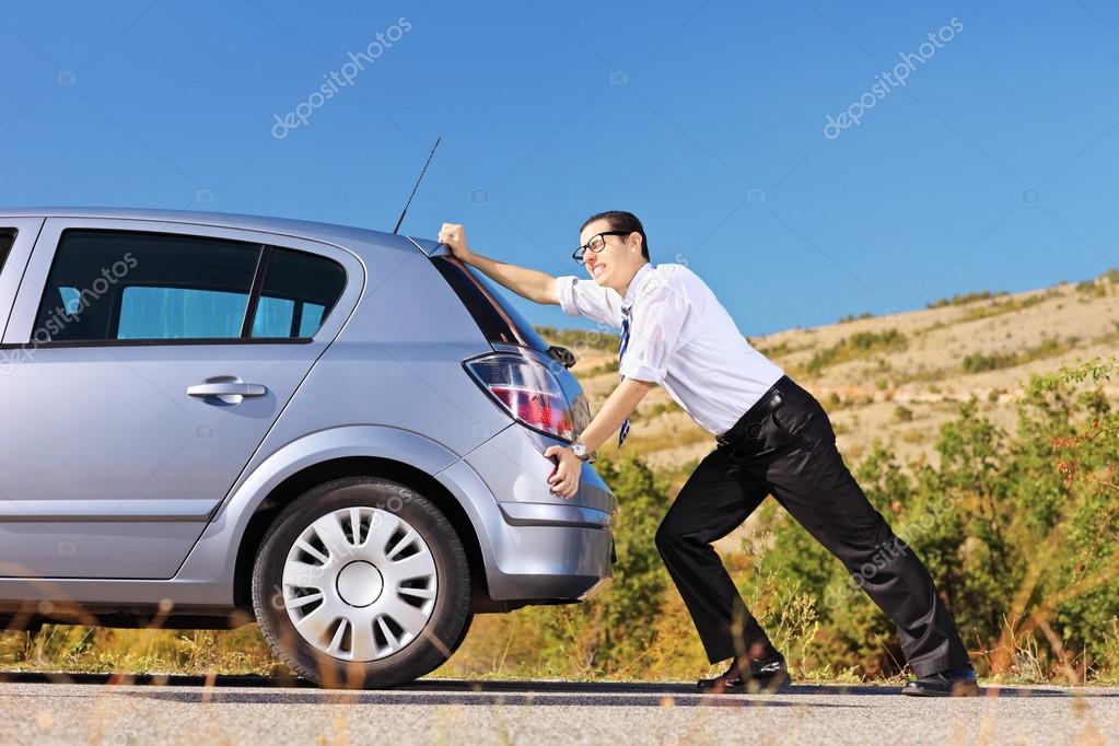 Man pushing his broken car Stock Photo by ©ljsphotography 45888307 Man pushing his broken car Stock Photo by ©ljsphotography 45888307