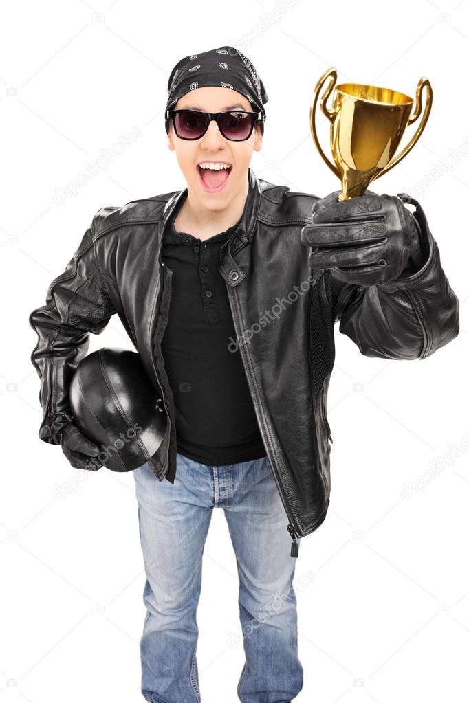 Biker holding trophy Stock Photo by ©ljsphotography 45891381