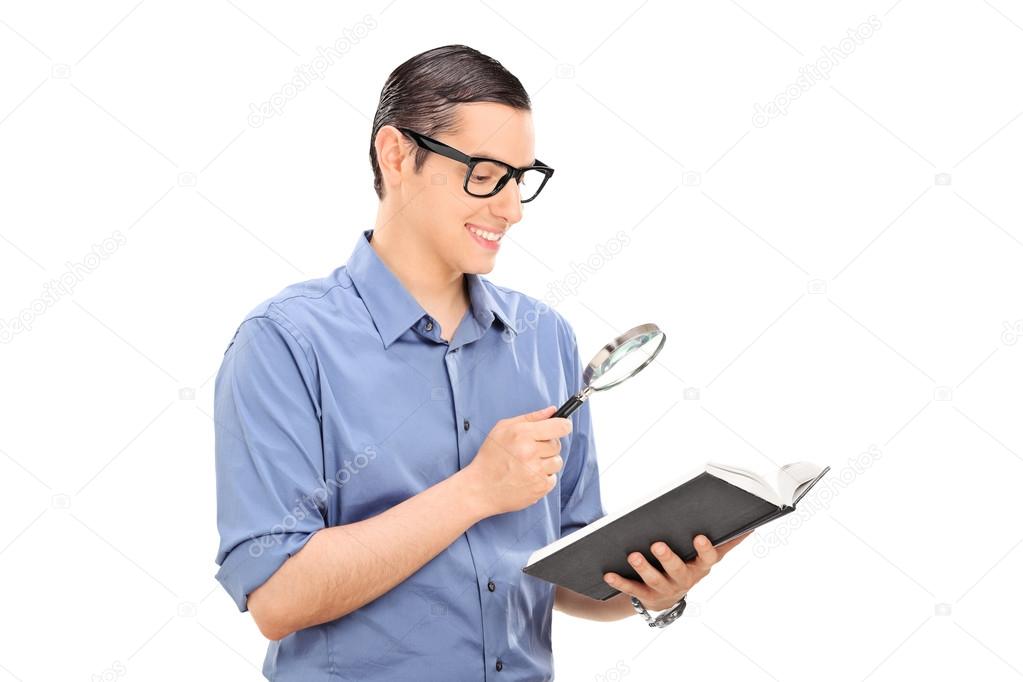 Guy reading book through scrutiny — Stock Photo © ljsphotography #48314581 Guy reading book through scrutiny — Stock Photo © ljsphotography #48314581