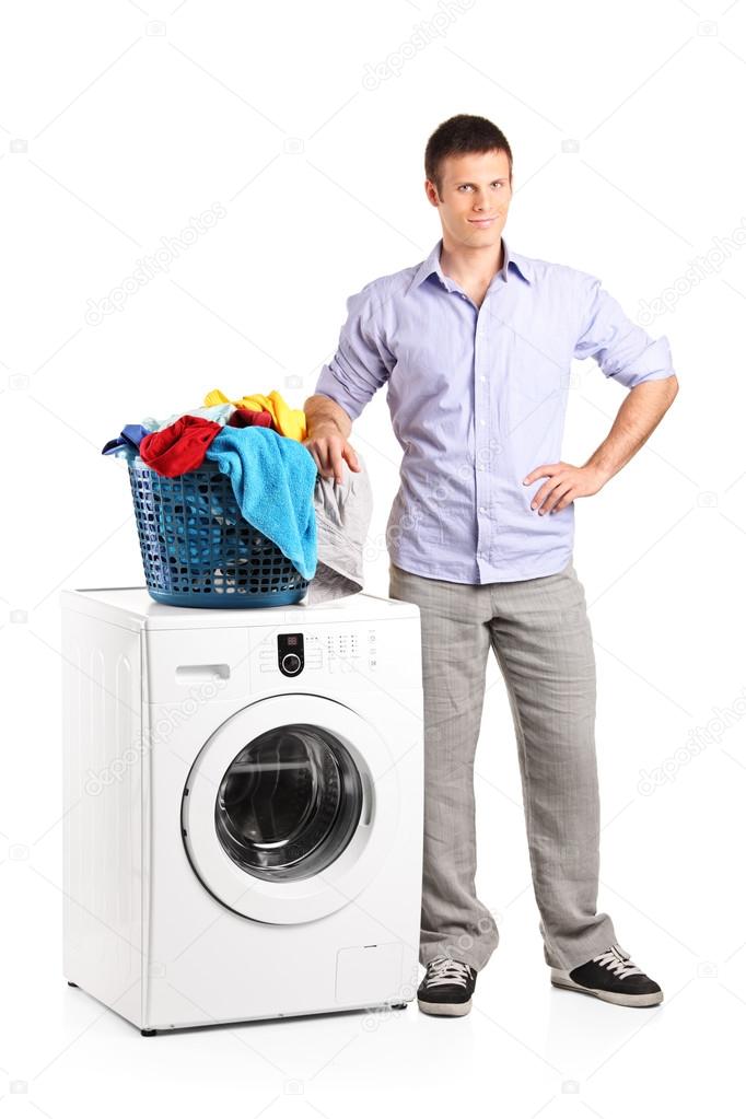 Guy standing by washing machine Stock Photo by ©ljsphotography 48618379