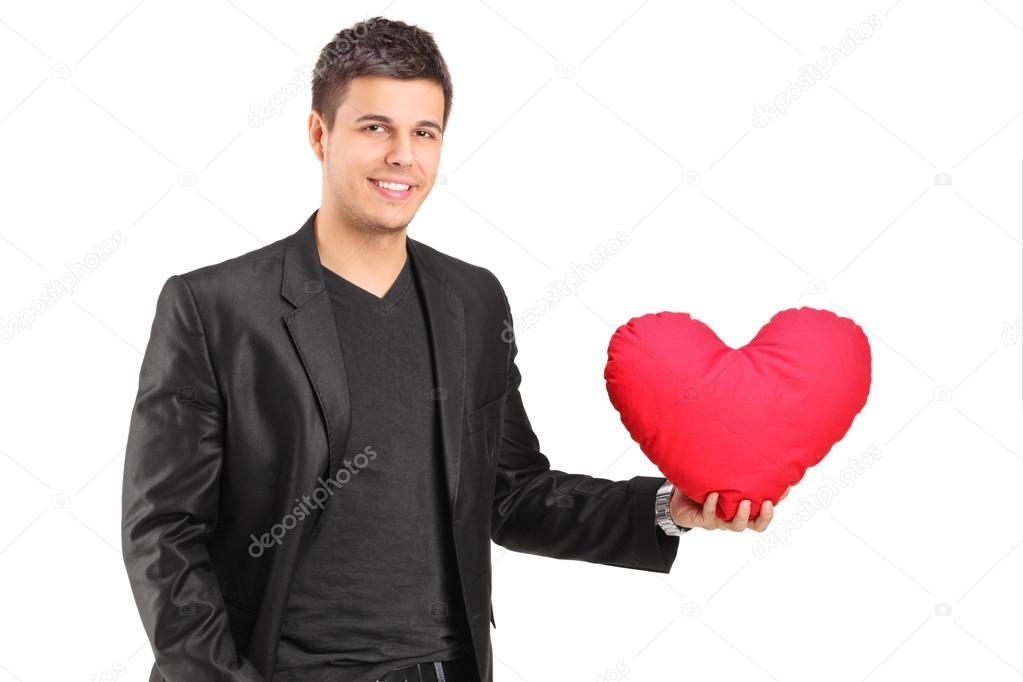Romantic young man holding heart Stock Photo by ©ljsphotography 49781429
