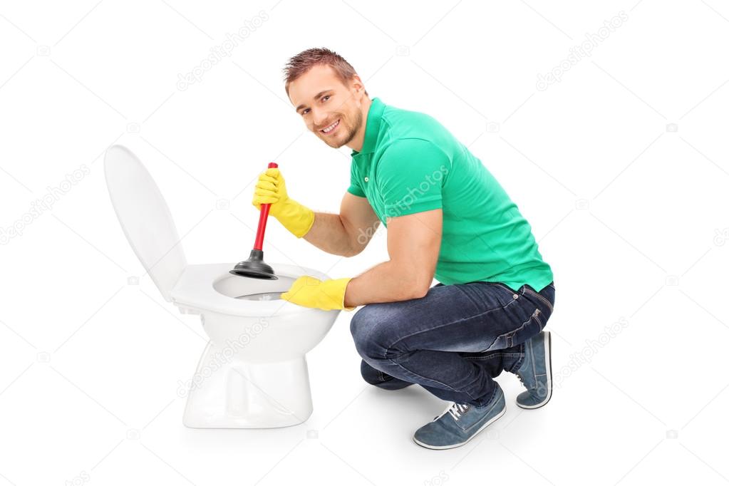 Man unclogging toilet with plunger — Stock Photo © ljsphotography #51155633
