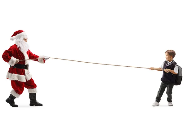 Kid pulling santas leg Stock Photos, Royalty Free Kid pulling santas ...