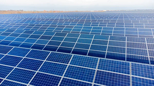 Aerial drone view flight over solar panels on sunny day close-up ...
