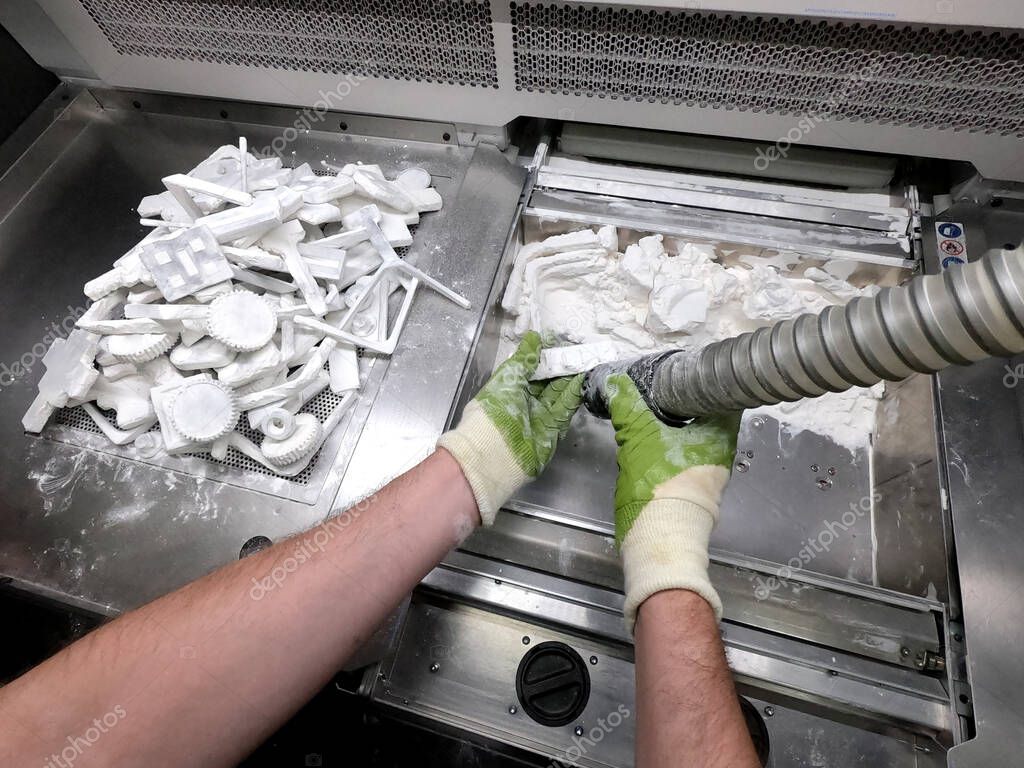 Engineer or artist designer printing 3D parts and shaping models from ...