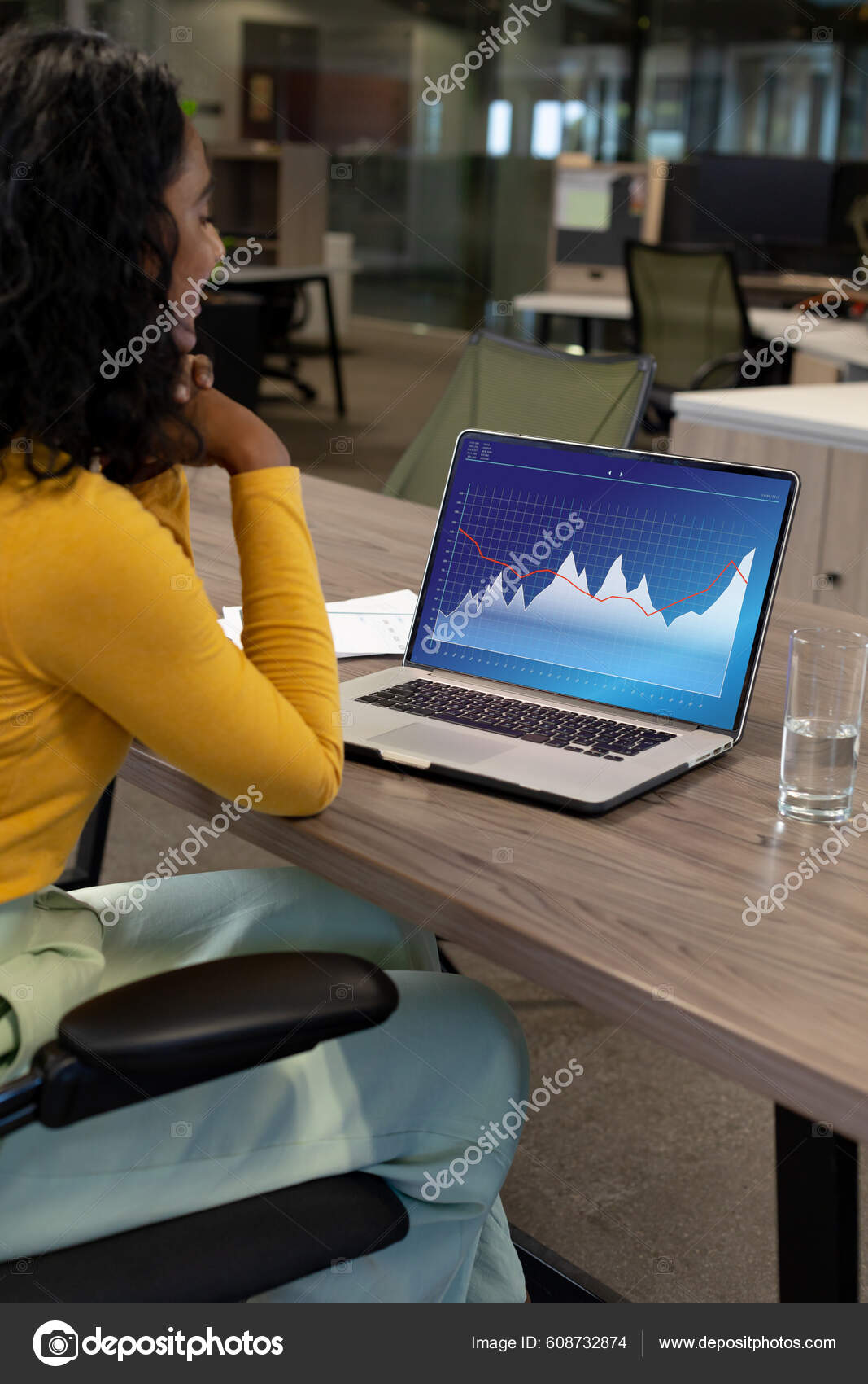 Vertical Image Biracial Businesswoman Using Laptop Empty Office Graphs ...