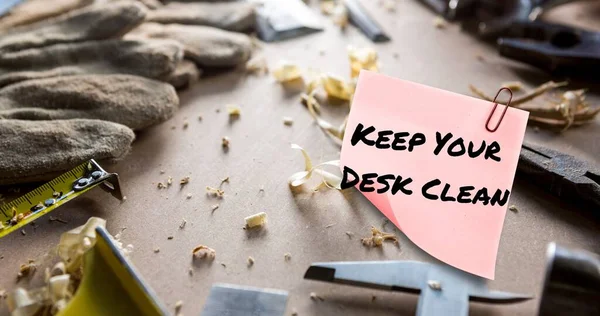 Composite of keep your desk clean text on sticky note with carpentry ...