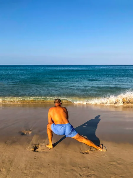 Man beach stretch Stock Photos, Royalty Free Man beach stretch Images ...