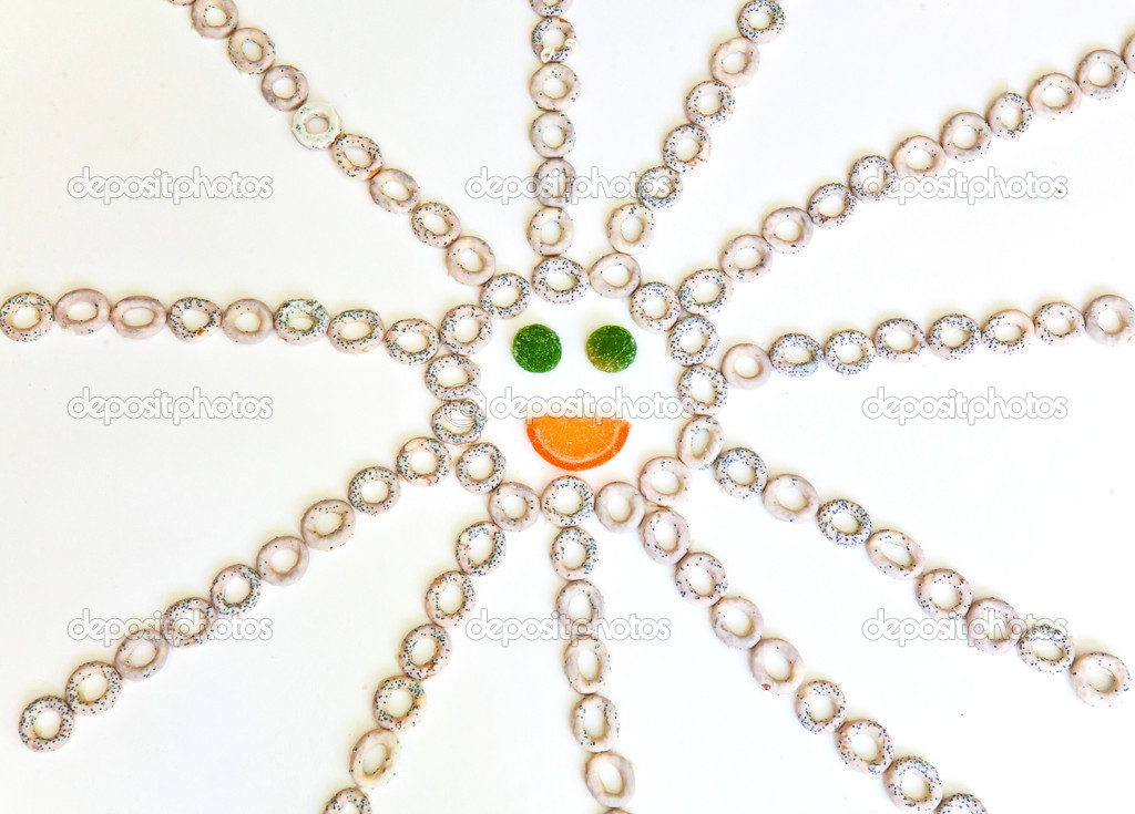 Face made of sweets and cracknels Stock Photo by ©dina777 47694471