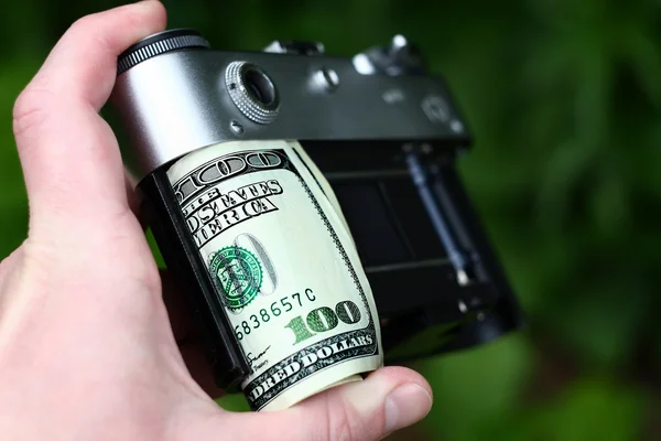 dollars in camera - Stock Image - Everypixel