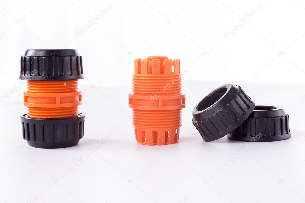 Orange adapter for connection of a garden hose with watering system ...