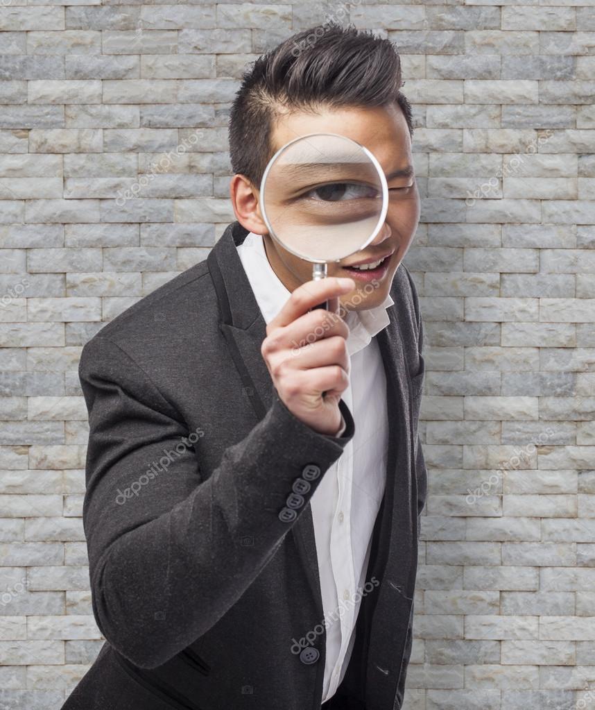 Man with magnifying glass — Stock Photo © AsierRomeroCarballo #47469663