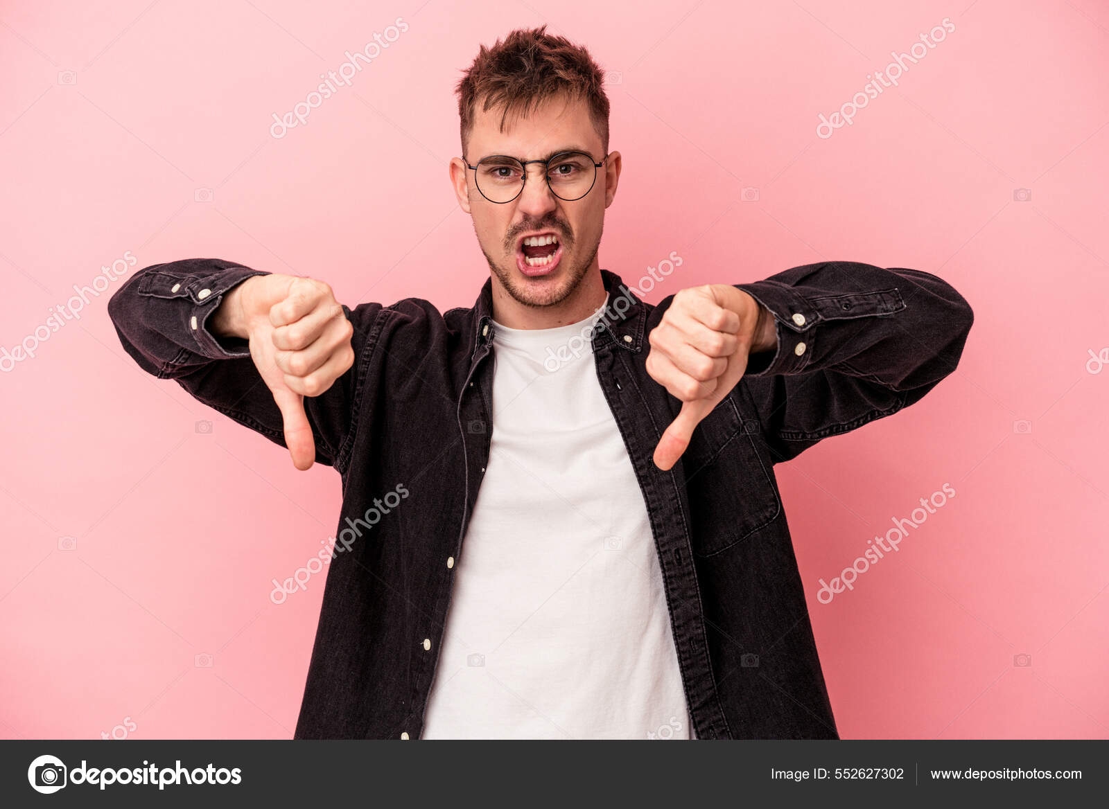 Young Caucasian Man Isolated Pink Background Showing Thumb Expressing ...