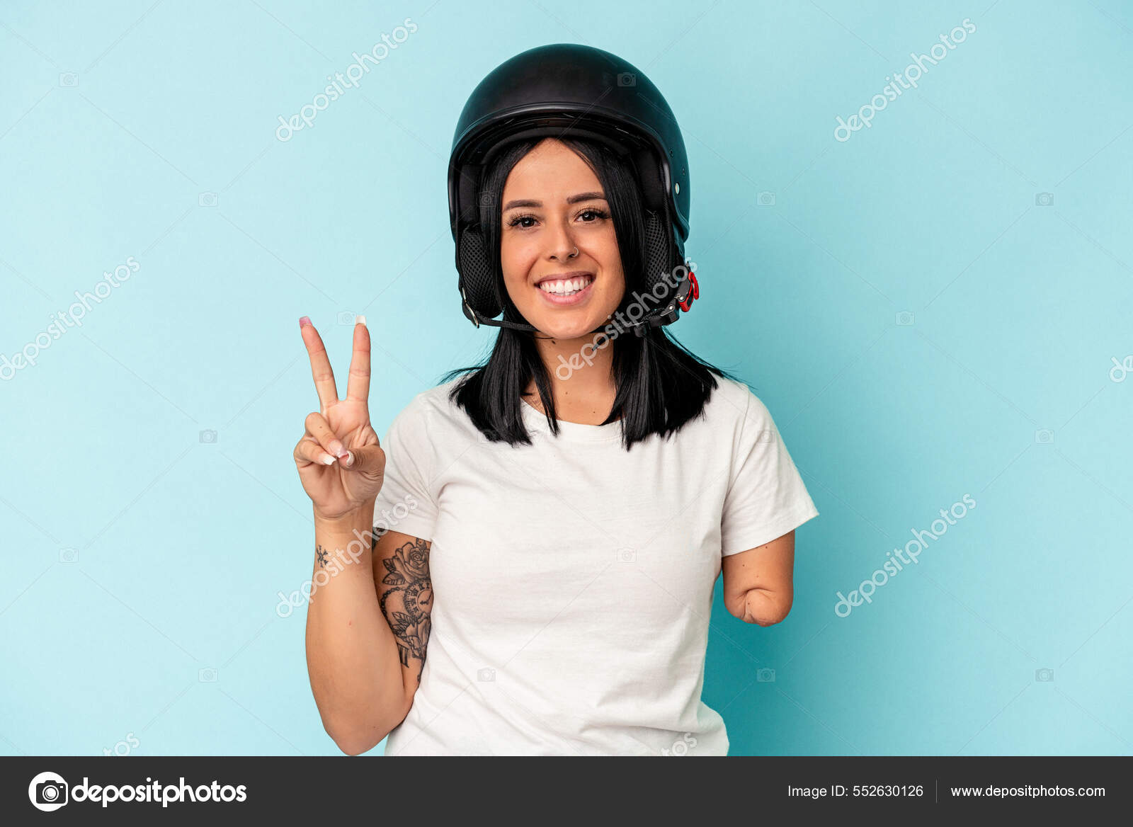 Young Caucasian Woman One Arm Wearing Motorcycle Helmet Isolated Blue ...