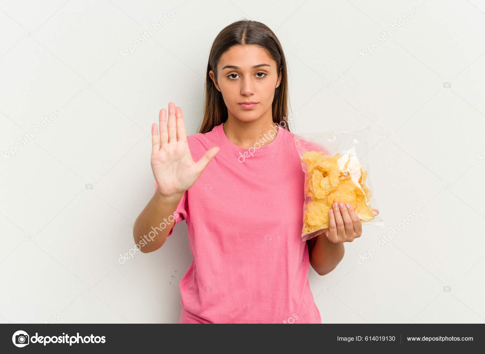 Young Indian Woman Holding Crips Isolated White Background Standing ...