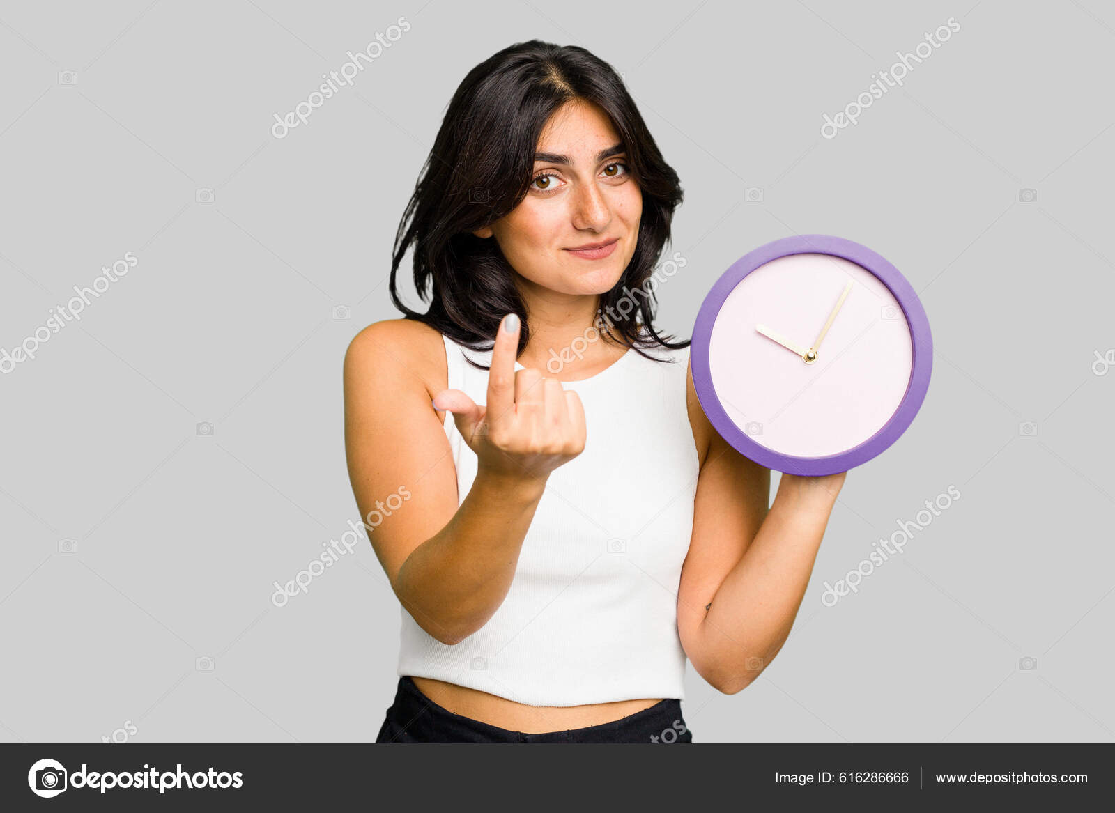 Young Indian Woman Holding Clock Isolated Pointing Finger You Inviting ...