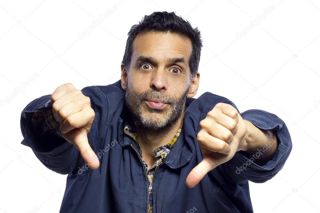 Worker disapproving with a thumbs down gesture — Stock Photo ...