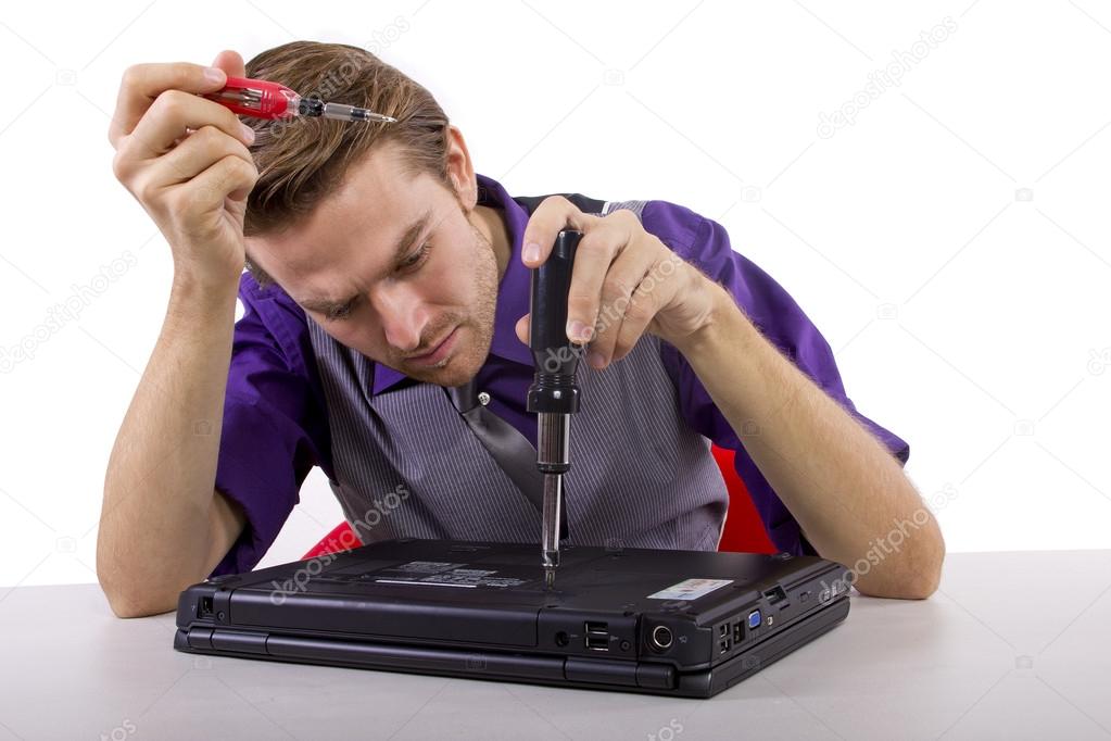 Man fixing a computer — Stock Photo © innovatedcaptures #49309825