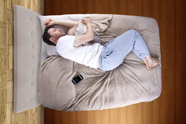 A guy flung all over the couch — Stock Photo © txking #12122706