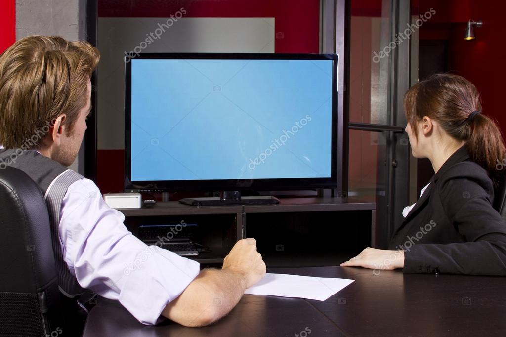 Business team watching tv screen — Stock Photo © innovatedcaptures ...