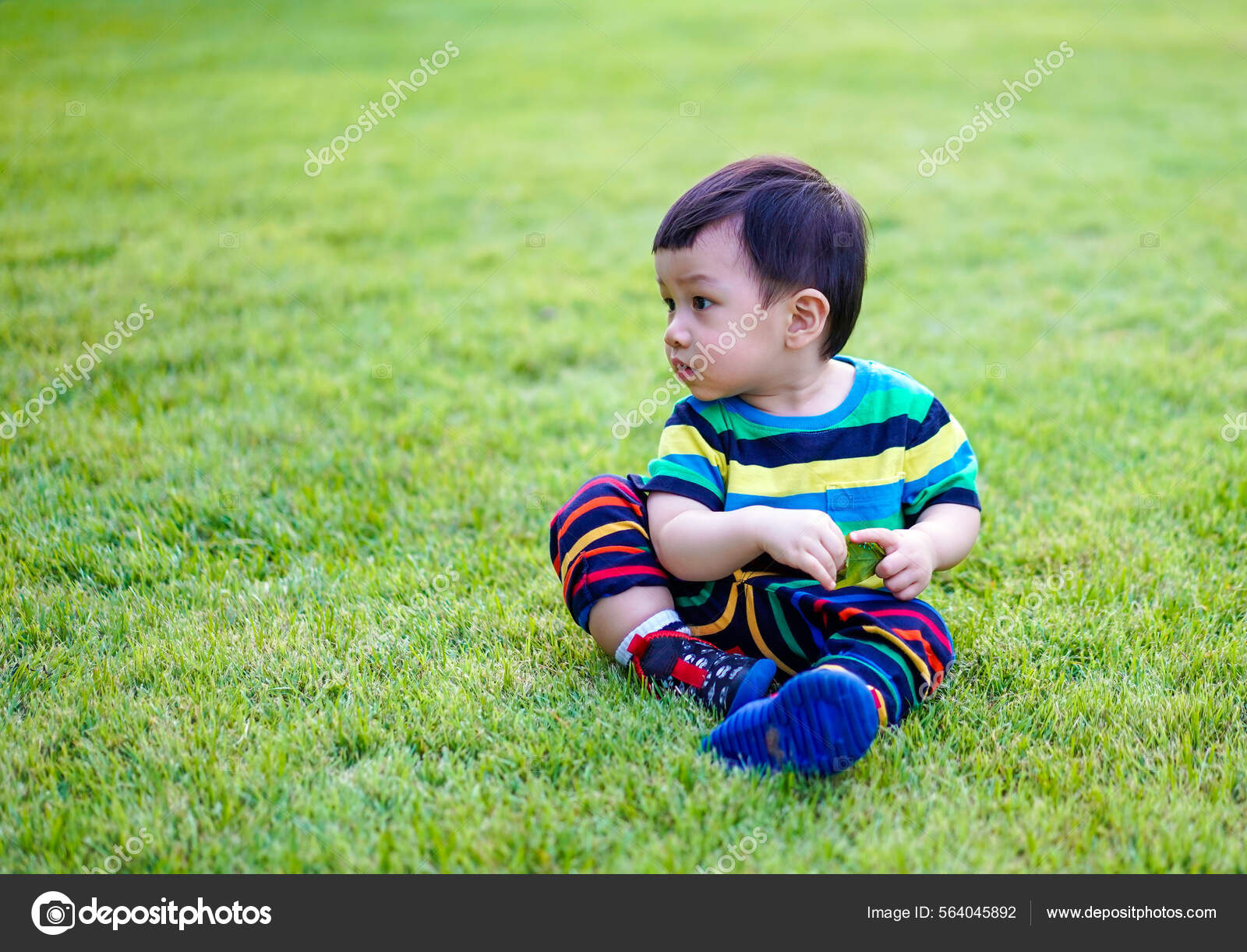 Kid Sit Thoughtful Grass Idea Space Cute Baby Boy Striped Stock Photo ...