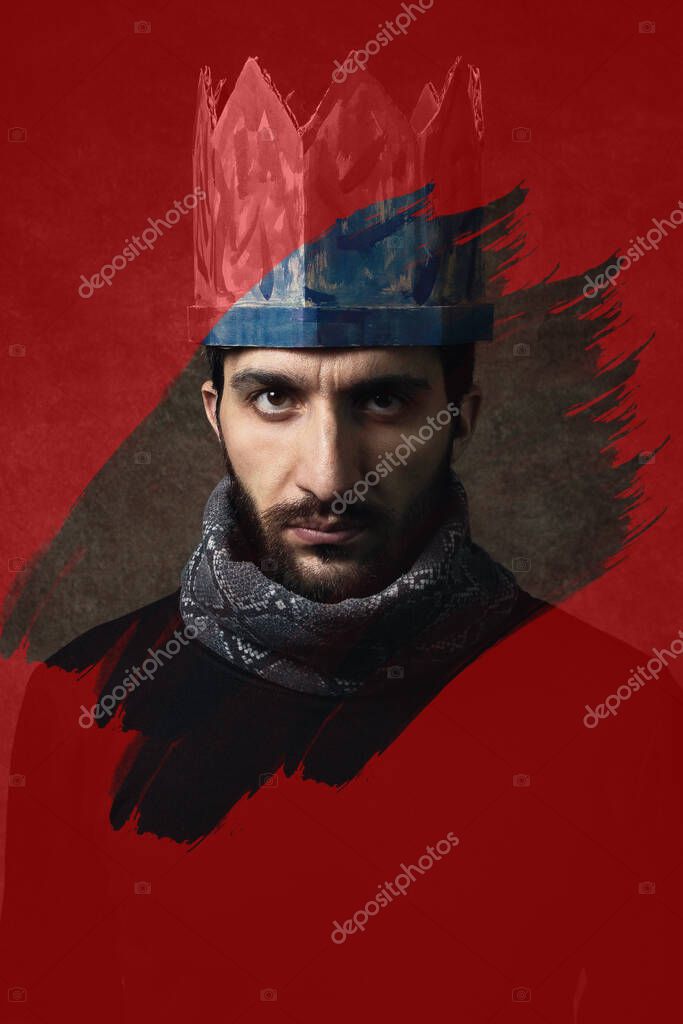Creative male portrait. A man with a beard wearing a paper crown ...