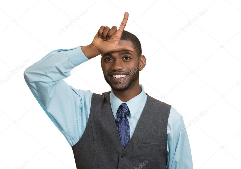 Young executive giving loser sign Stock Photo by ©SIphotography 50272771