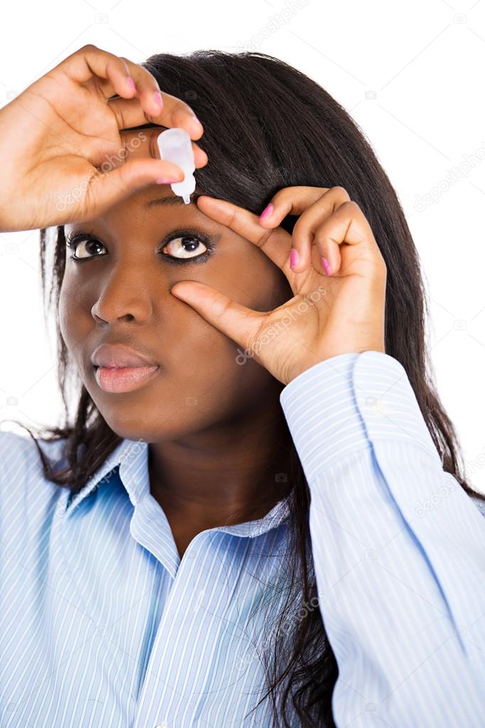 Woman applying eye drops — Stock Photo © SIphotography #50323063