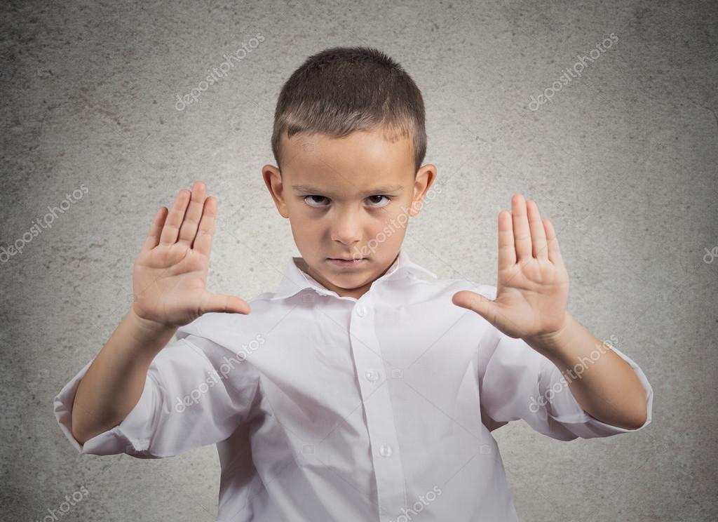 Boy giving stop gesture with hands Stock Photo by ©SIphotography 51625969
