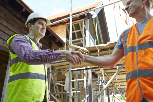 Customer Shaking Hands With Builder Stock Photo by ©HighwayStarz 49262967