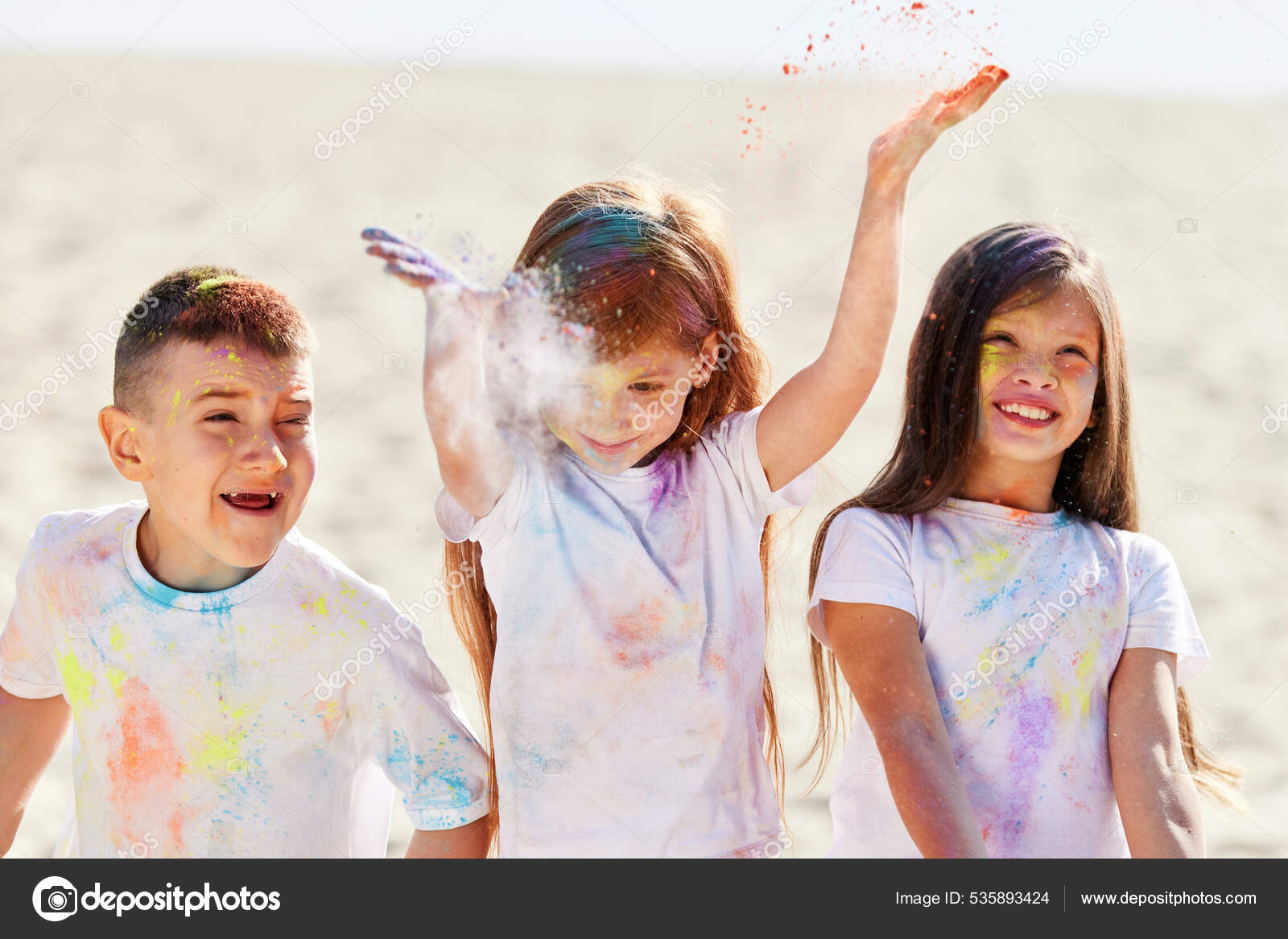 Kids having fun by playing with colored powder — Stock Photo © erstudio ...