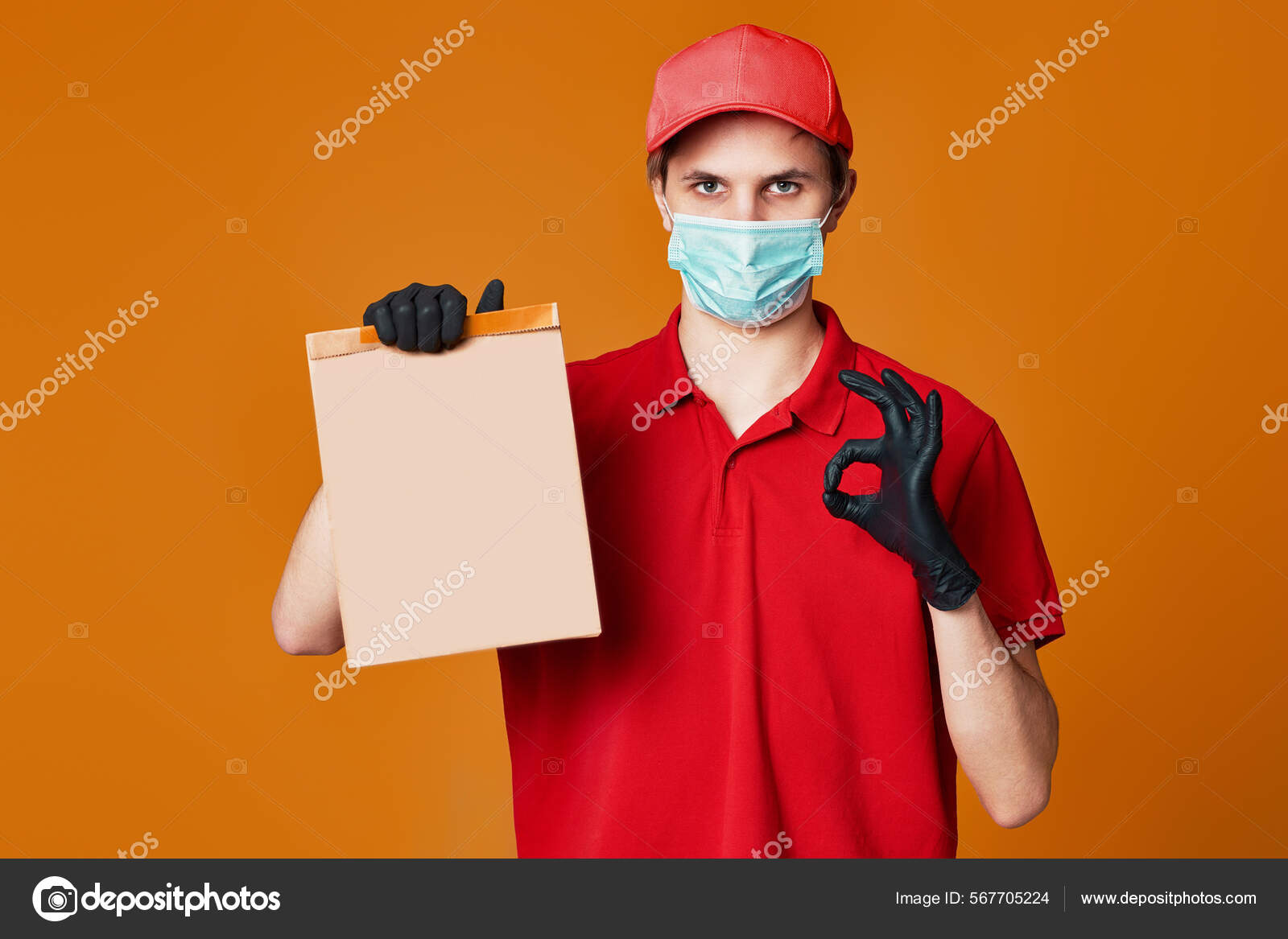 Delivery man employee in red cap face mask, empty cardboard box Stock ...