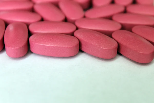 Pink pile of tablets vitamins or pills Stock Photo by ©iammotos 178952502
