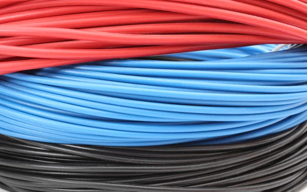 Red, blue and black cable on white background - Stock Image - Everypixel