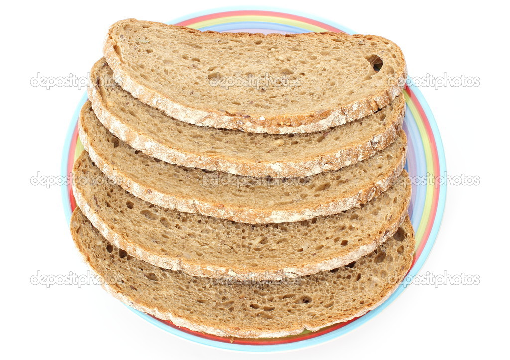 Slices of rye bread and colorful plate Stock Photo by ©ratmaner 48753649