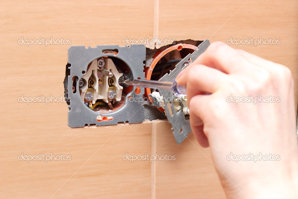 Electrician installing a power socket Stock Photo by ©ratmaner 50168883
