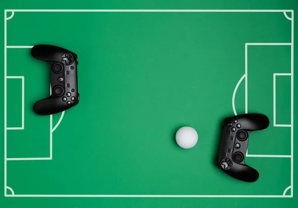 Two modern game pads competing in football game on the - Stock Image ...