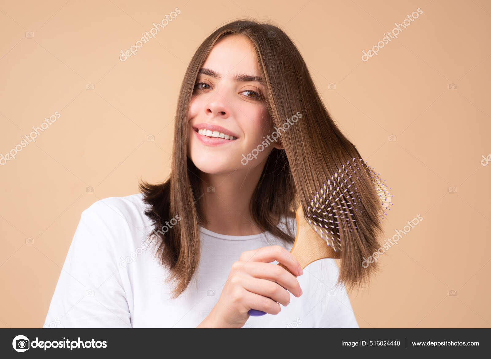Beautiful woman combs her healthy hair. Combing healthy long straight ...
