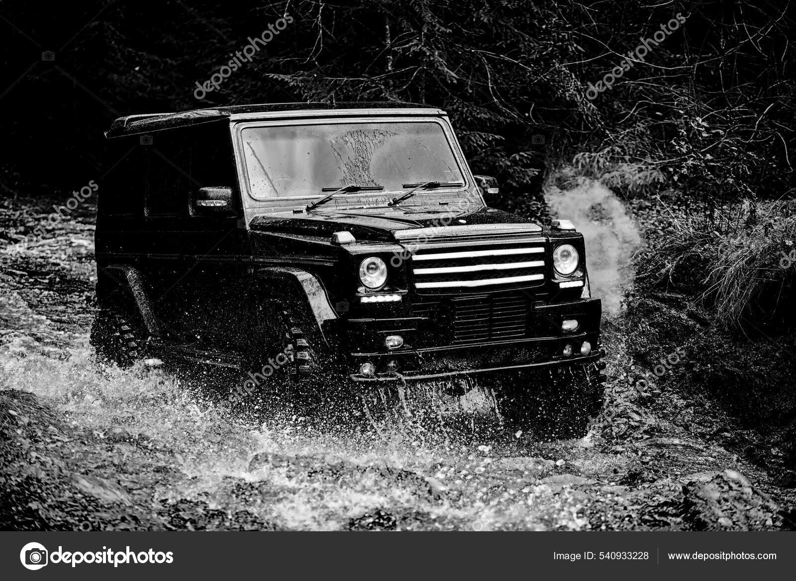 Mud and water splash in off-road racing. Off the road travel on ...