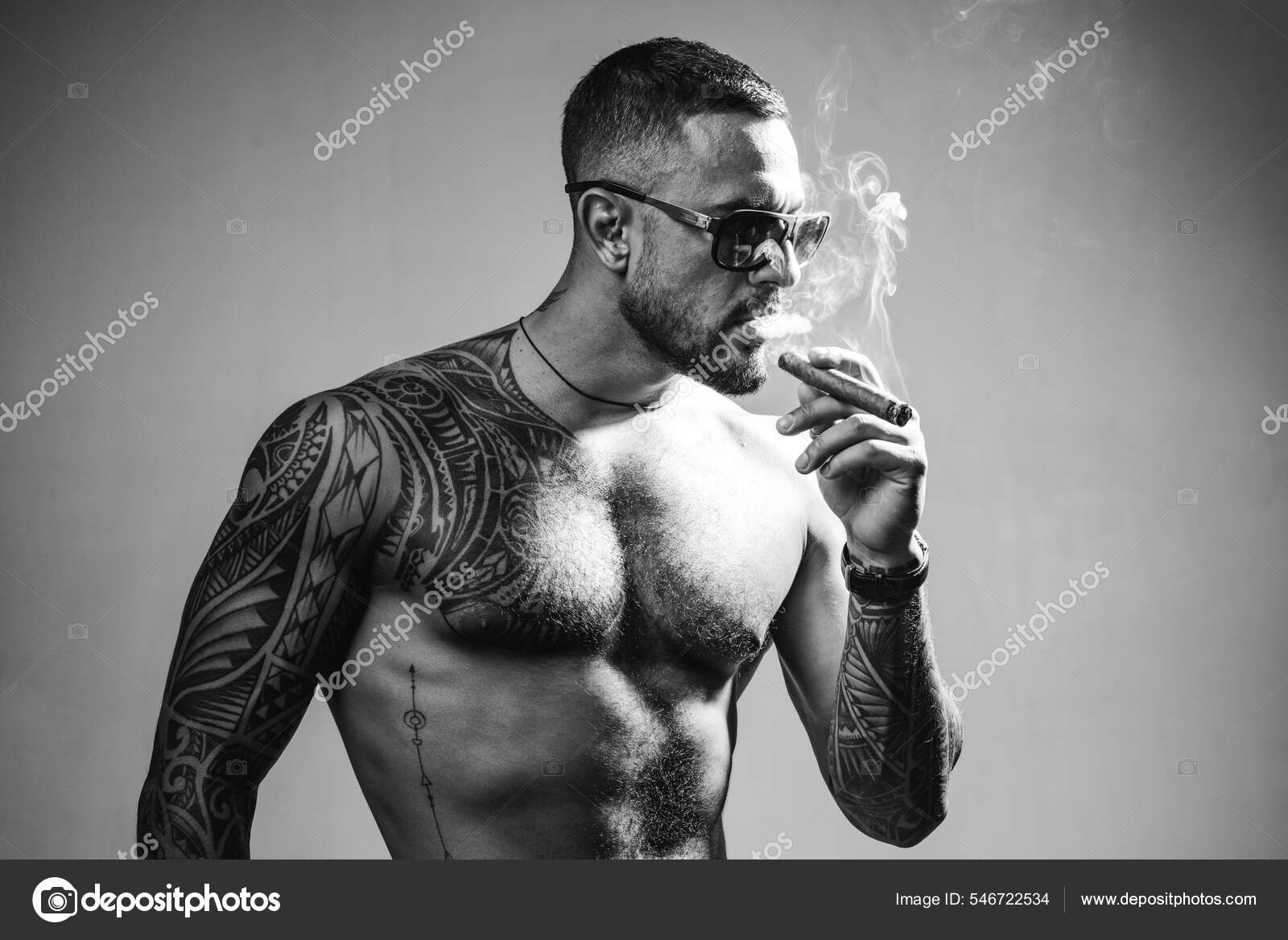 Brutal Man Smoking Cigar Serious Face Of Handsome Male Model Concept