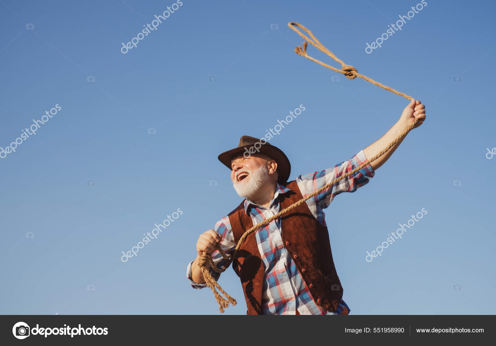 Lasso throwing. Old wild west cowboy with rope. Bearded western man ...